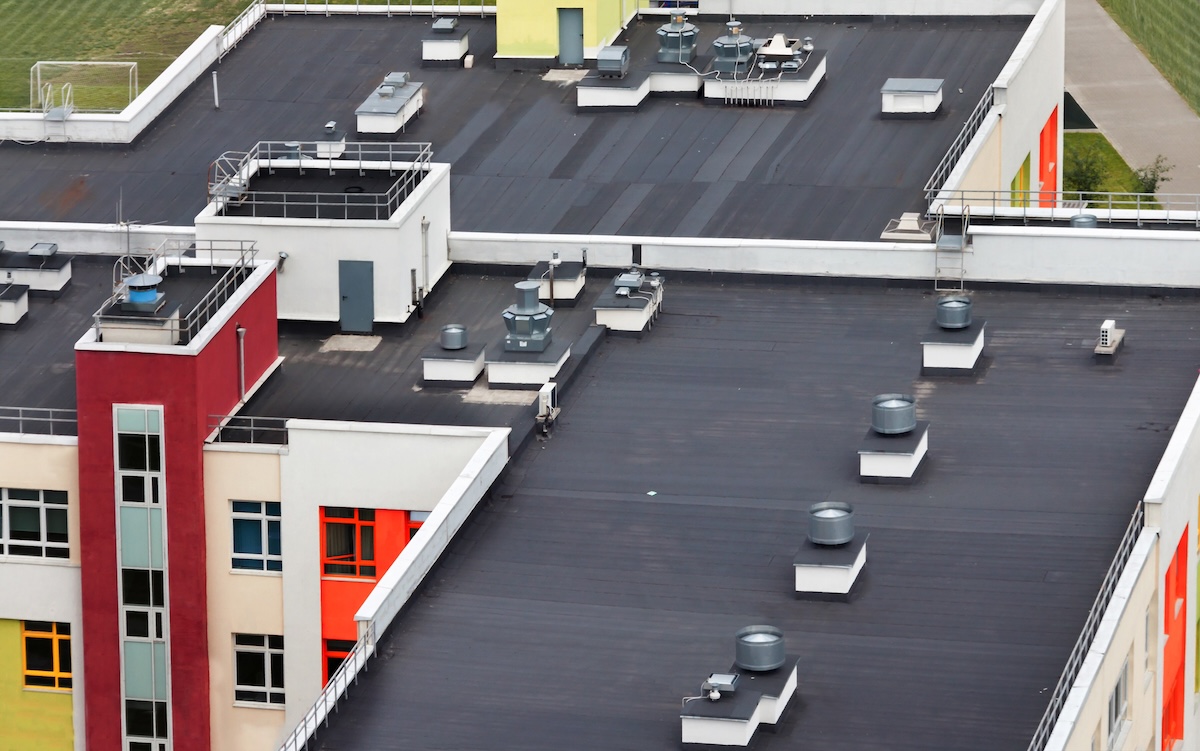 Commercial Roof Cleaning: How To Clean A Flat Roof In 7 Steps